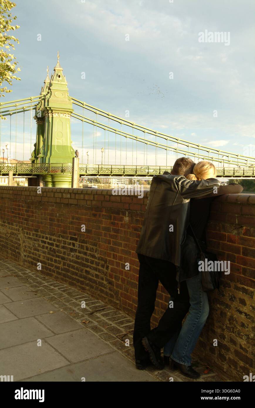 Couple by Hammersmith Bridge leaning on wall. - Hammersmith and Fulham ...