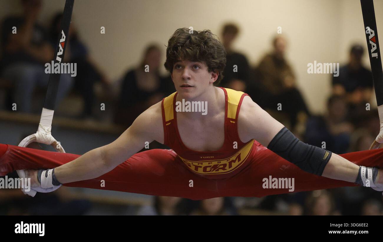 Simpson's Ethan Drake competes on the rings during an NCAA gymnastics ...