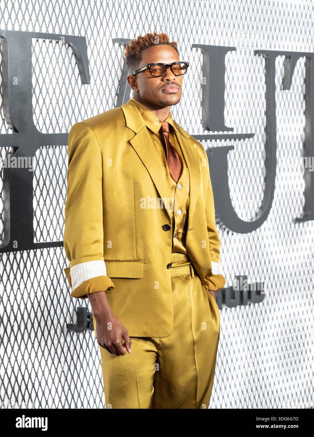 Jeremy Pope wearing suit by Yves Saint Laurent attends premiere of FX's ...