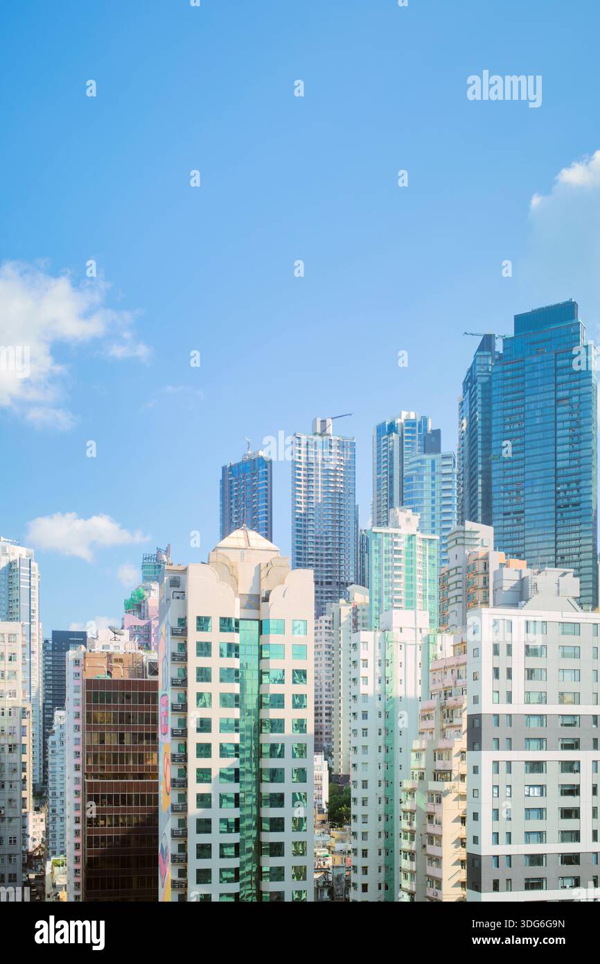 Scenic view of modern skyscrapers under a clear blue sky. Hongkong ...