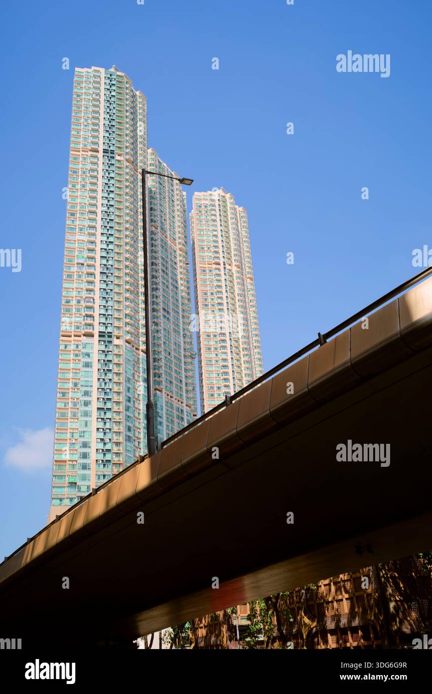 Tall skyscrapers under a clear blue sky with an overpass in the ...