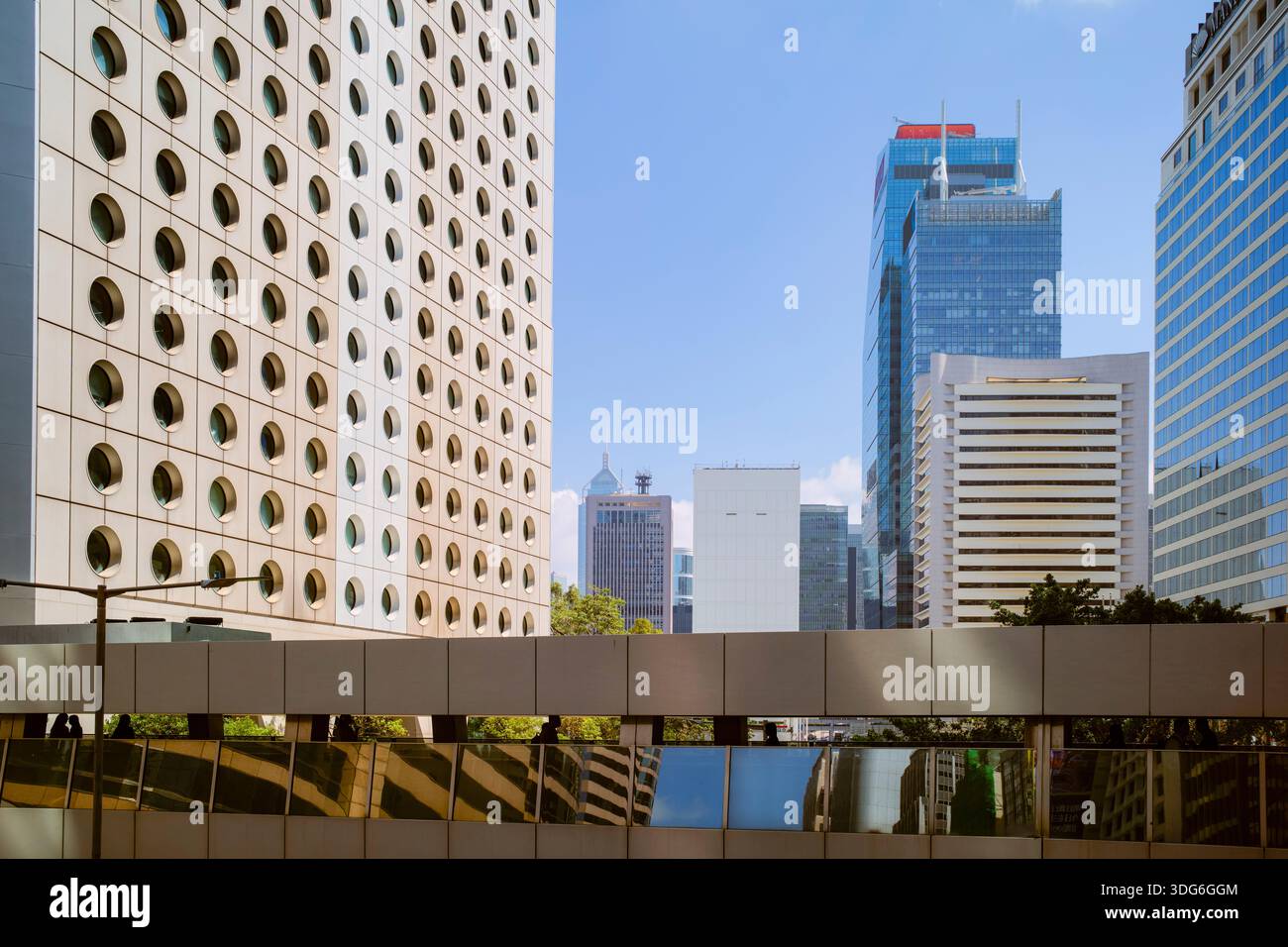 Urban skyline with modern high-rise buildings under a clear blue sky ...