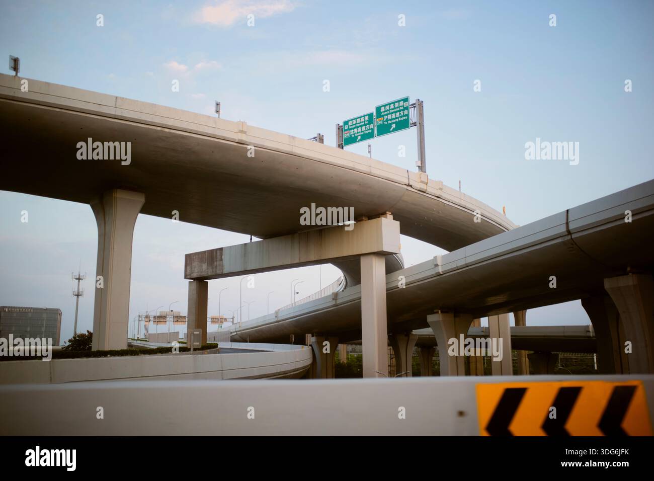 Elevated highways intersect against a clear blue sky, featuring ...