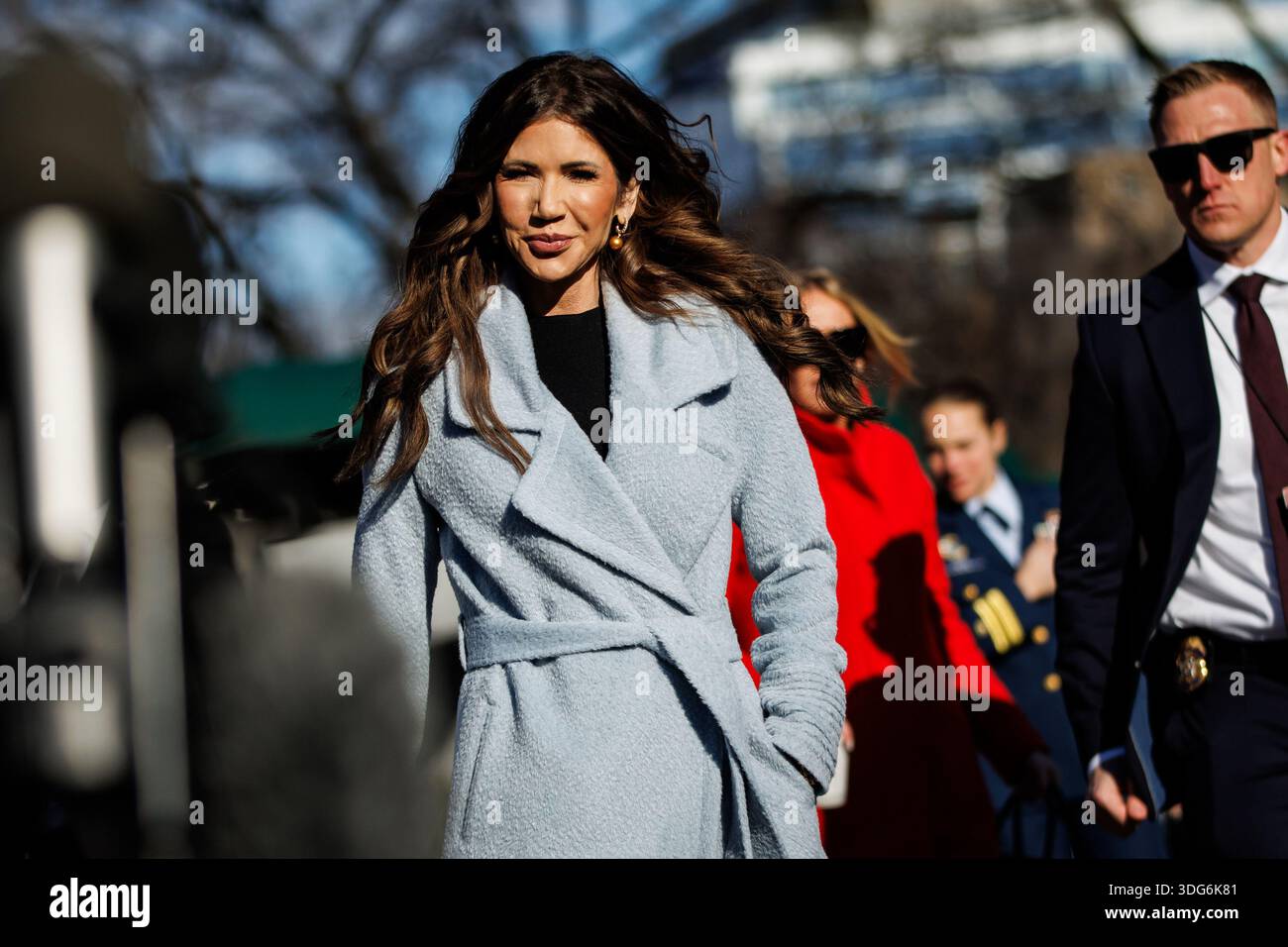 Secretary of the Department of Homeland Security Kristi Noem walks to ...