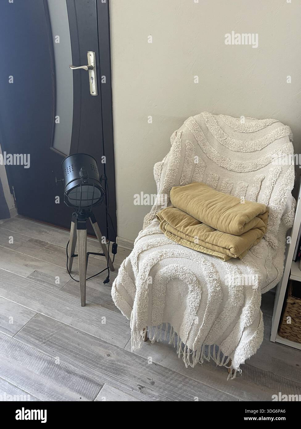 lamp near the chair with blanket Stock Photo - Alamy