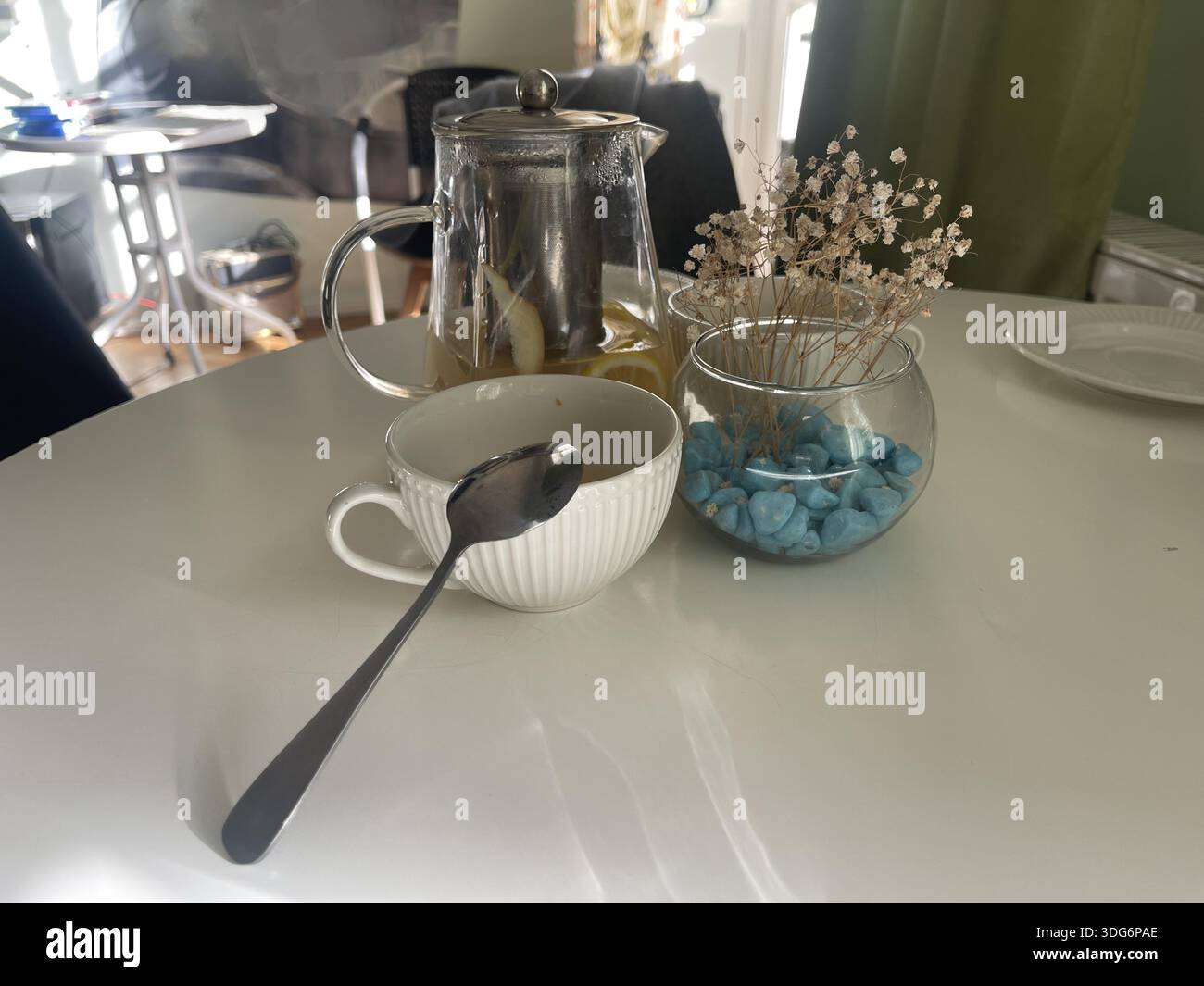 tae set with decor vase on the table in cafe Stock Photo - Alamy