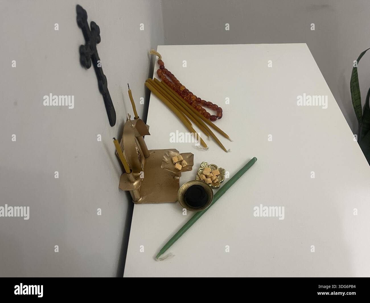 candles and rosary in the home altar. top view Stock Photo - Alamy