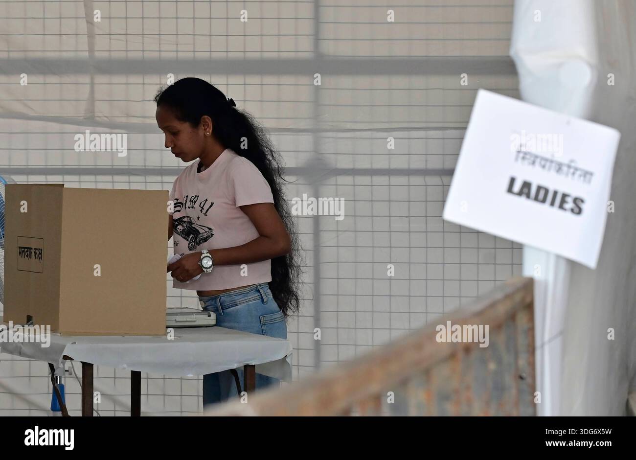 MUMBAI, INDIA - JANUARY 15: Voter casting her vote, during BMC election ...