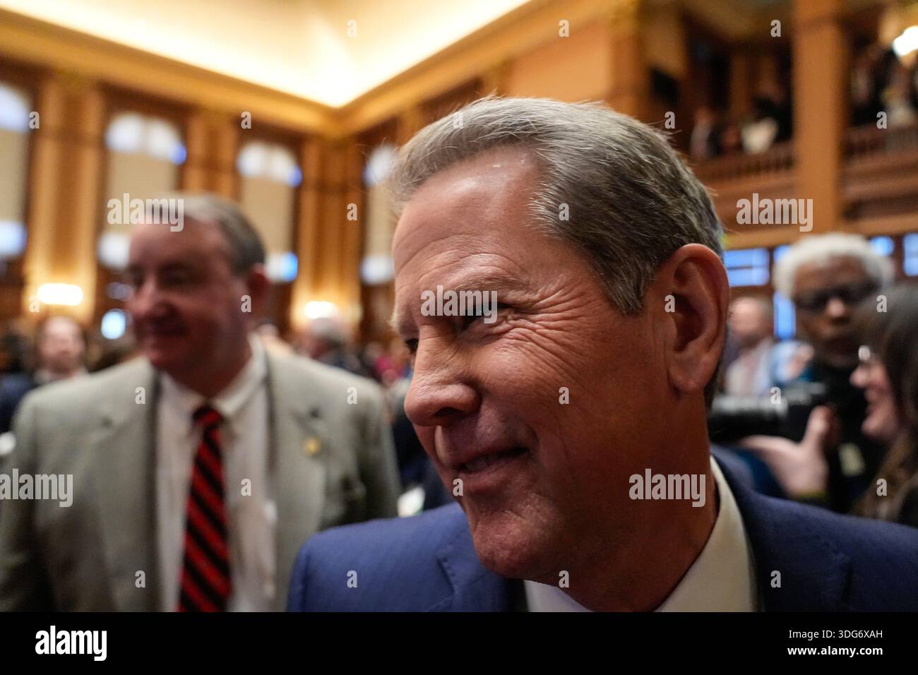 Gov. Brian Kemp departs the House floor after delivering the State of ...