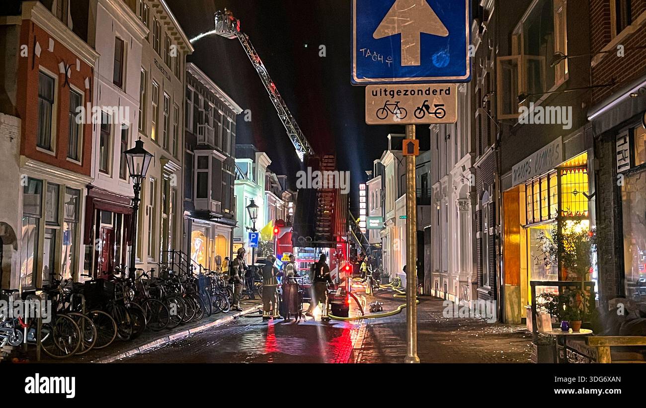 Firefighters extinguish the fire at the scene of an explosion in ...