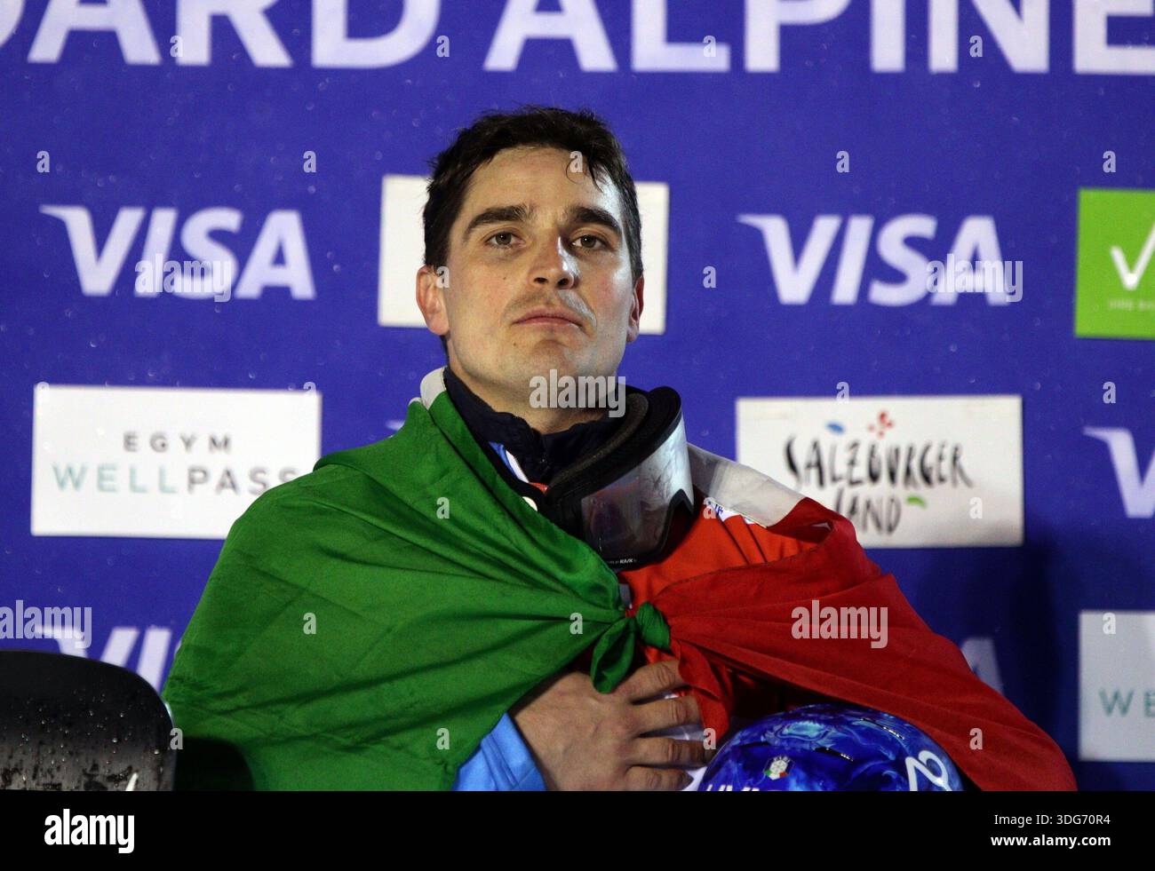 BAD GASTEIN, AUSTRIA - JANUARY 13: Podium with Flag, Winner BORMOLINI ...