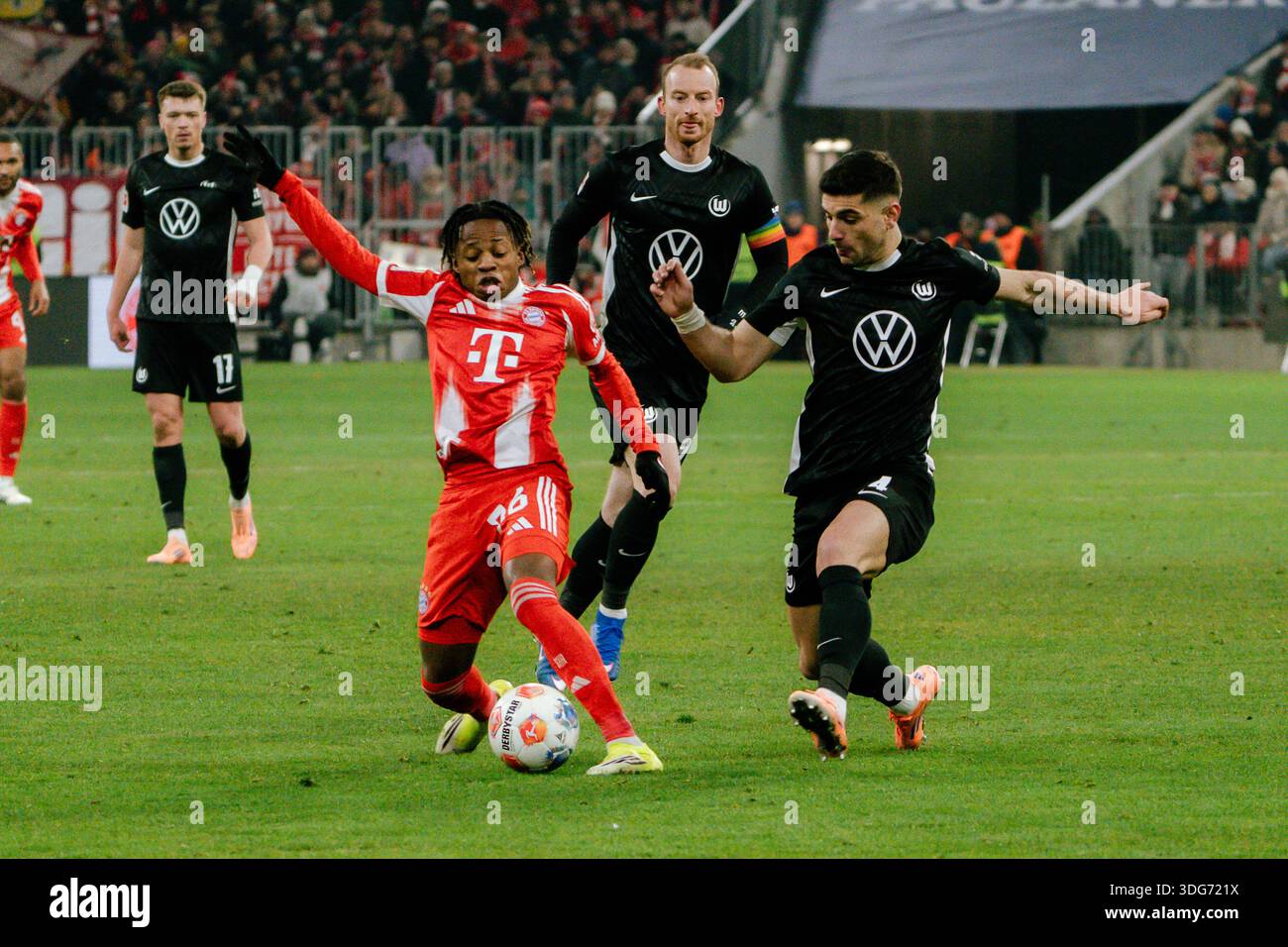 Tackle between Wisdom Mike (FC FC Bayern Munich, #36) and Konstantinos ...