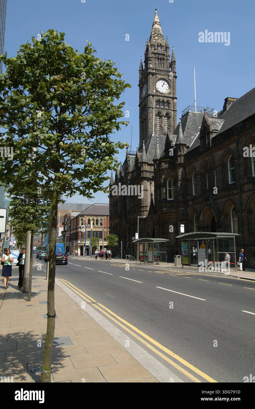 Middlesbrough Town Hall with clock tower viewed by a small group of ...