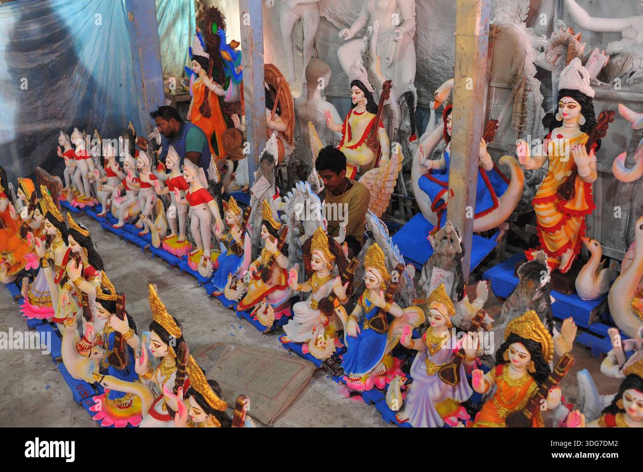Idol artists painting idols of Goddess Saraswati as preparations ...