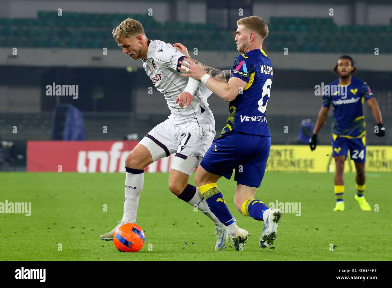 Bologna's Jens Odgaard, left, and Verona's Nicolas Valentini in action ...