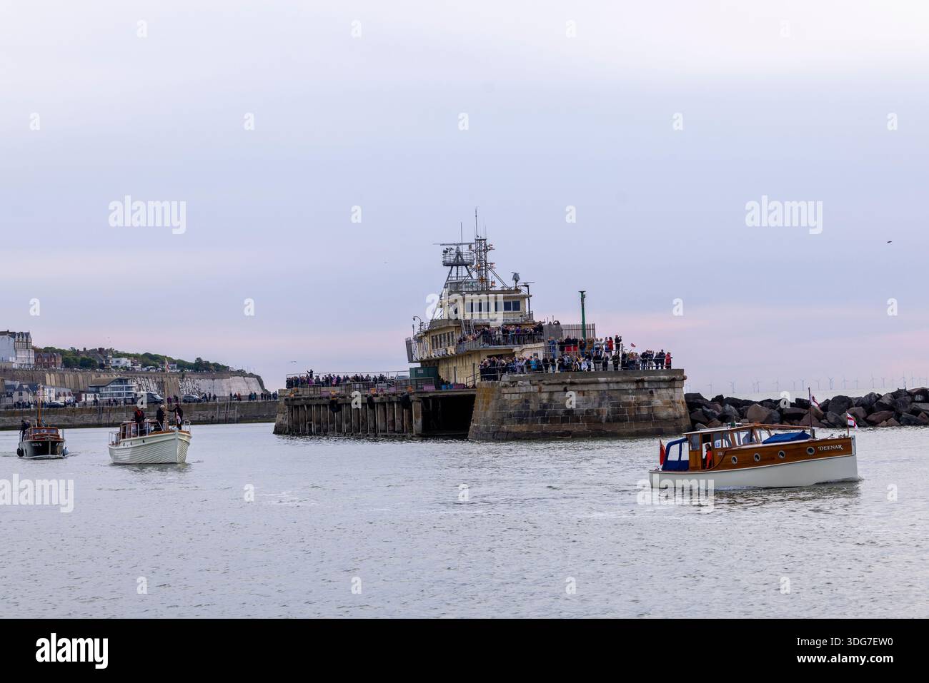 A large crowd watches Deenar and others leave Ramsgate Harbour at dawn ...