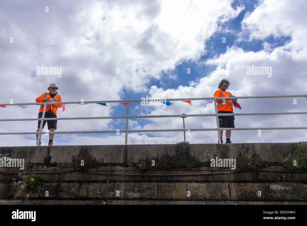 Ramsgate Town Council team put up flags on the harbour railings in ...