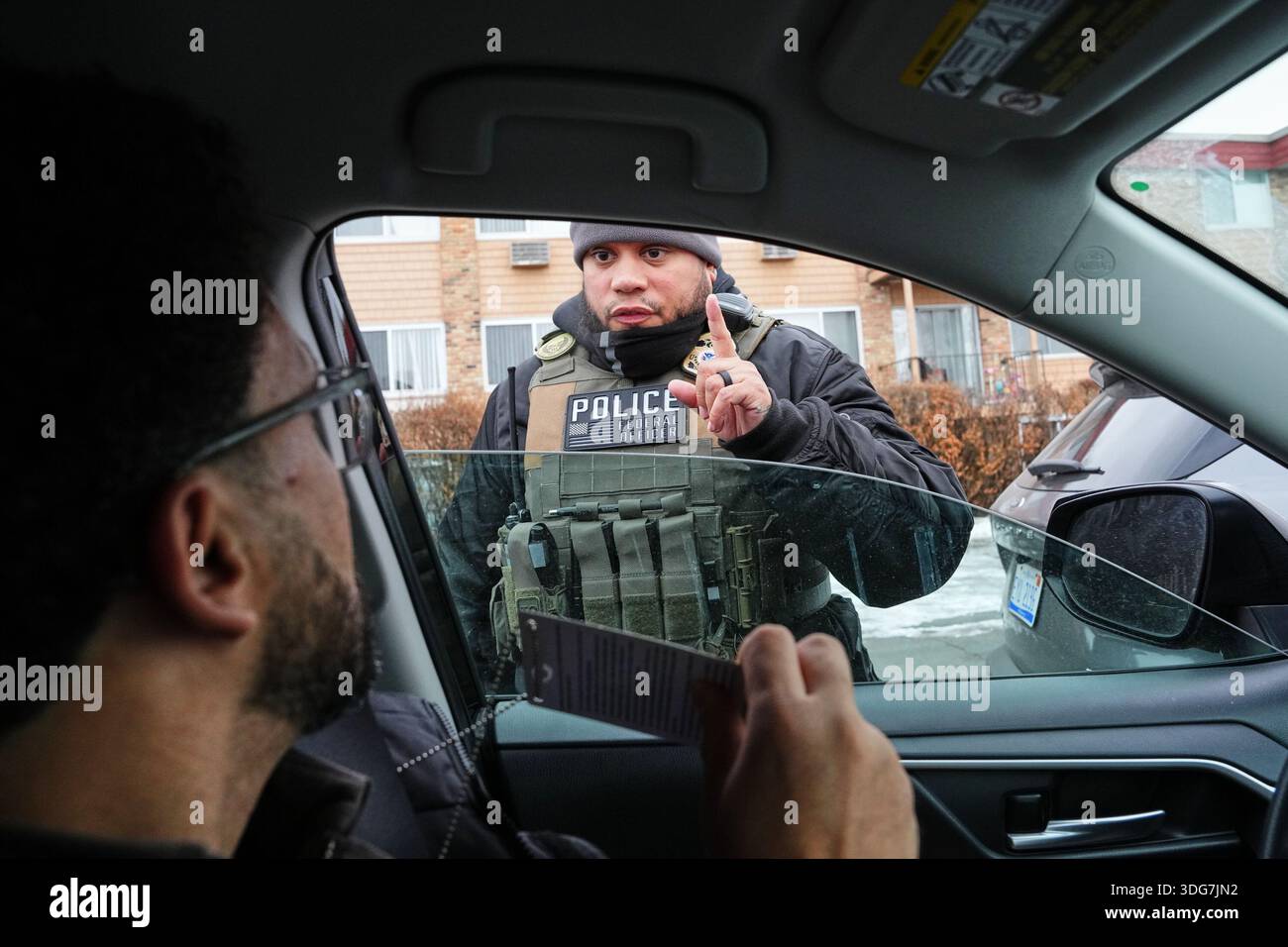 A federal immigration officer threatens a journalist with arrest if ...
