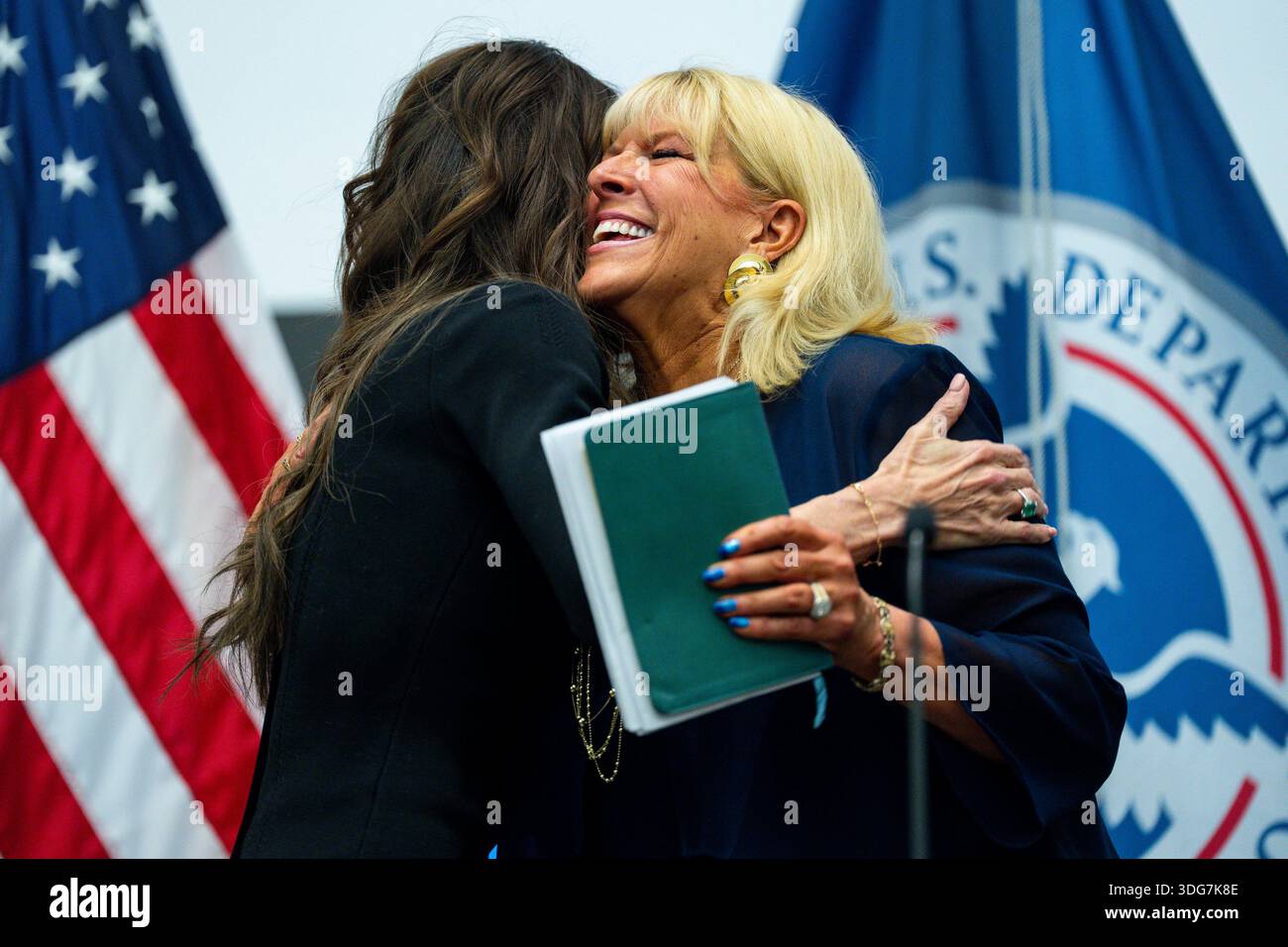 Secretary of the Department of Homeland Security Kristi Noem embraces ...