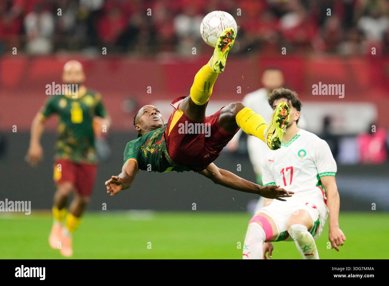 FILE - Cameroon's Che Malone, center, is in action during the Africa ...