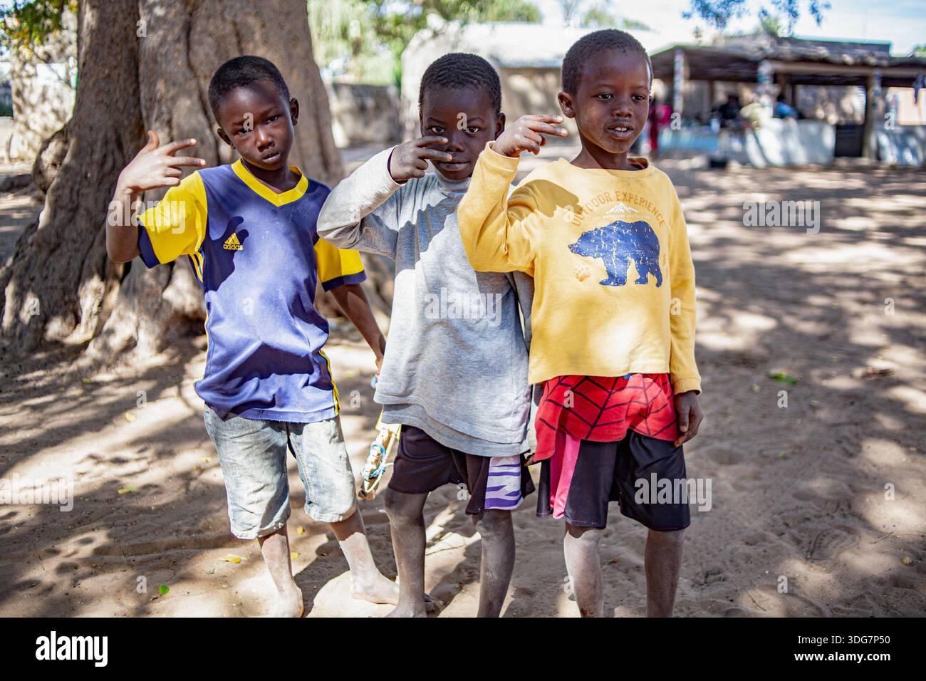 Three African children pose for the camera during the Christmas ...