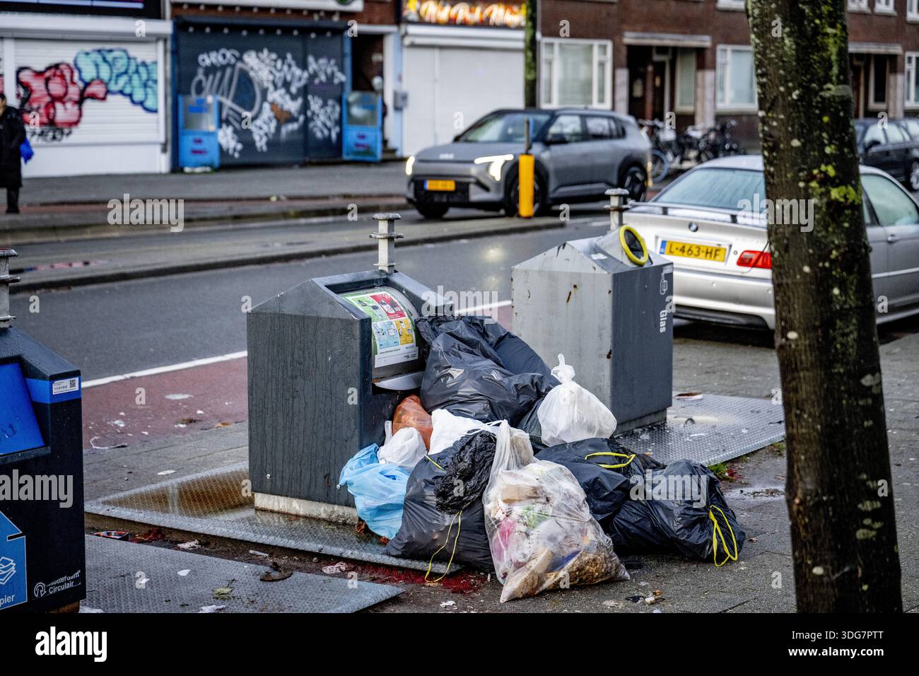 ROTTERDAM - Garbage bags in a residential area with separated waste in ...