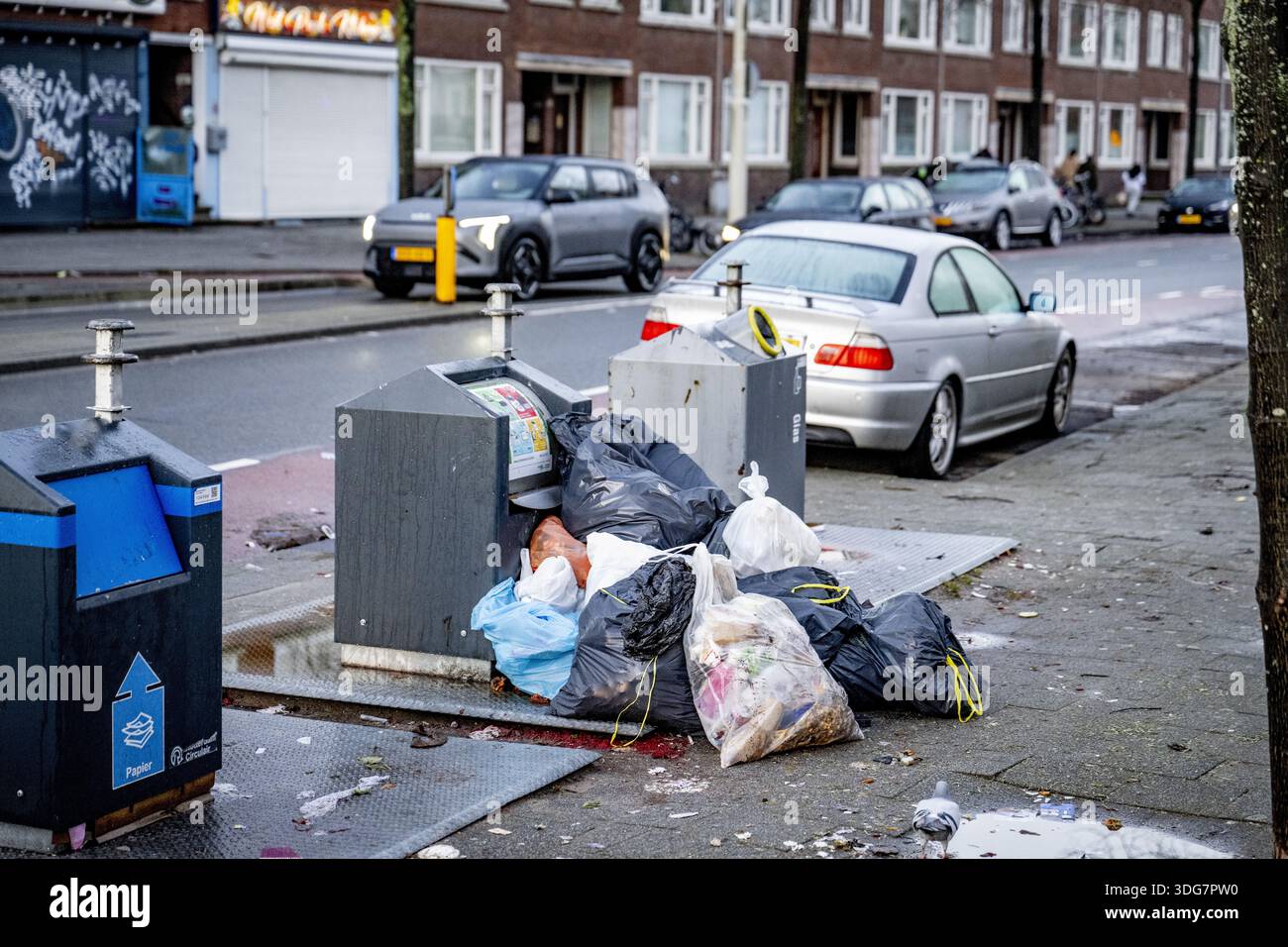 ROTTERDAM - Garbage bags in a residential area with separated waste in ...