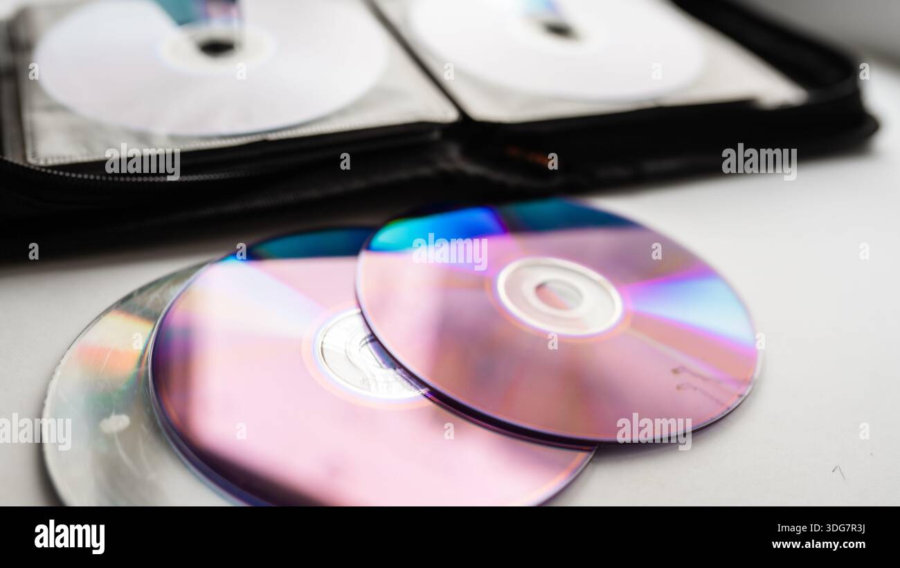 Bunch of CD and DVD discs organized in a disc holder Stock Photo - Alamy
