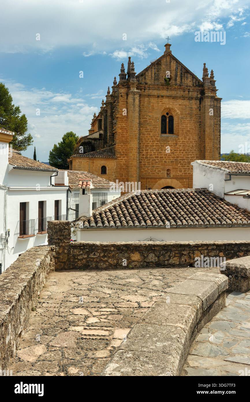 Stone facade of the Church of the Holy Spirit rising behind traditional ...