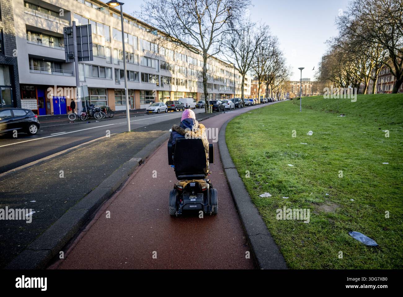 ROTTERDAM - An old woman in a mobility scooter ROBIN UTRECHT /ANP ...