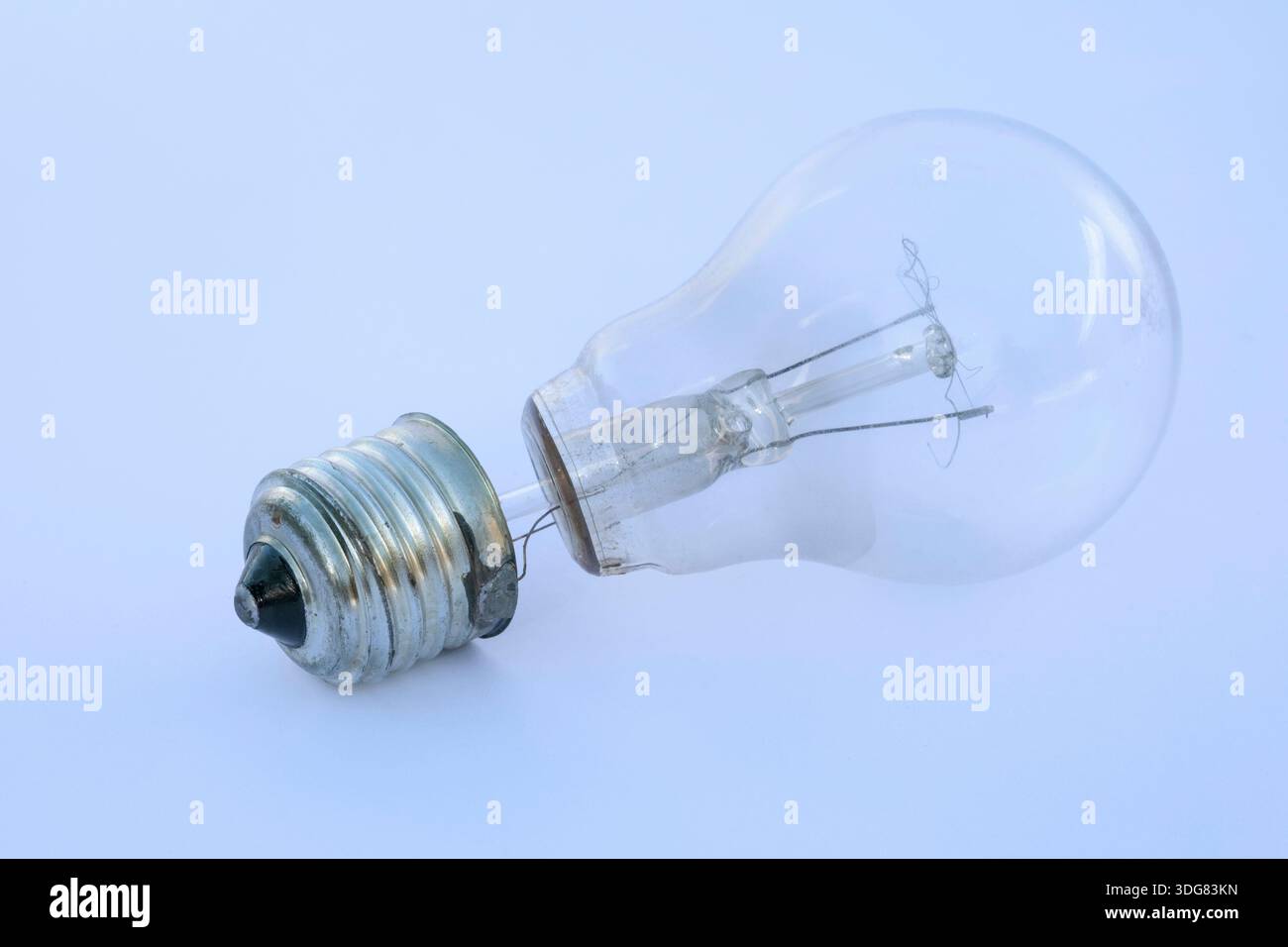 broken blown screw thread household incandescent lightbulb on plain ...