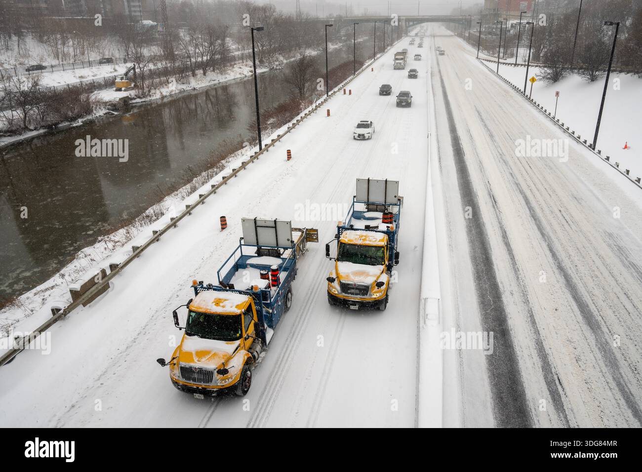 Safety trucks lead the reopening of the Don Valley Parkway during heavy ...