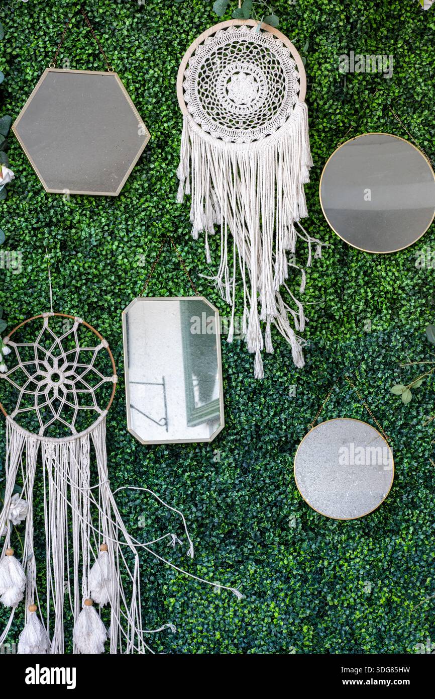 abstract of dreamcatchers and white-painted decorative mirrors on a ...