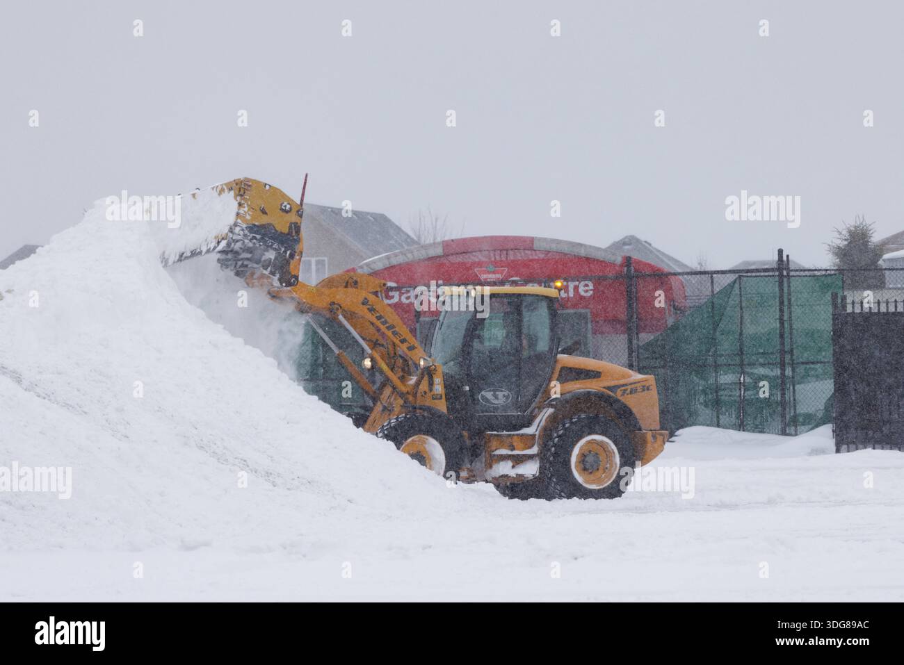 Crews face large mountains of existing snow in Orillia, Ont. while ...