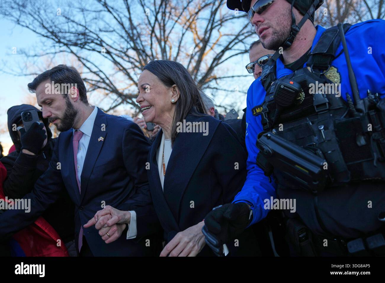 Venezuelan opposition leader María Corina Machado, center, leaves the ...