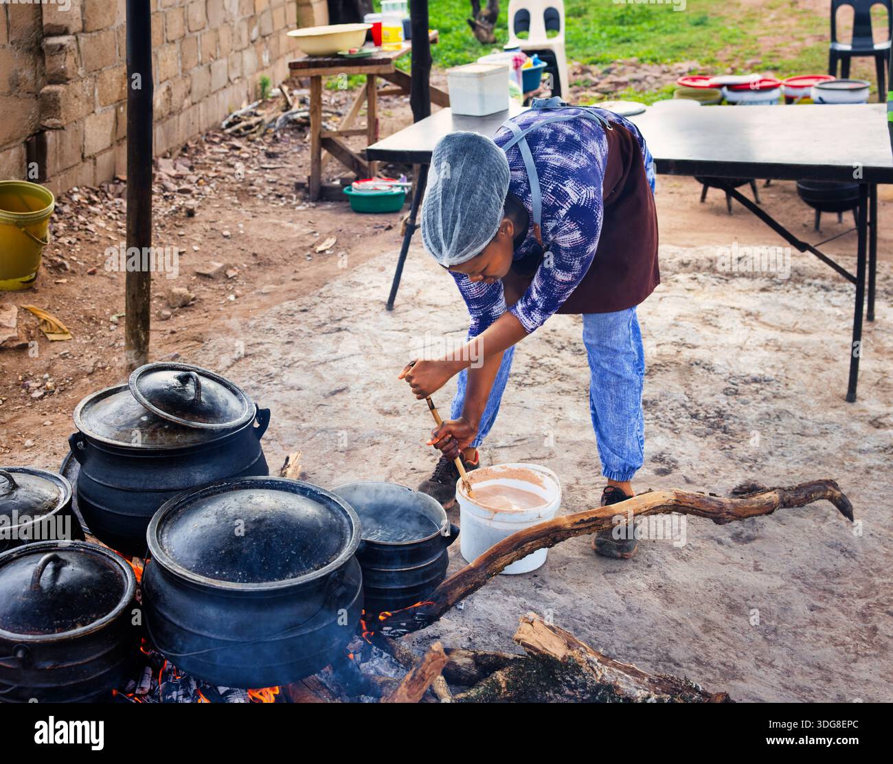 african woman street vendor selling food on the side of the road ...