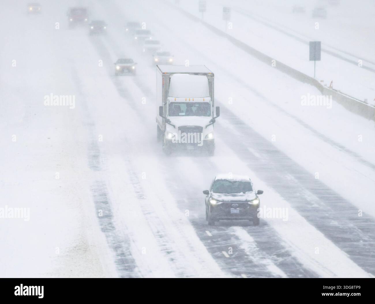 Toronto, Canada. 15th Jan, 2026. Vehicles drive on a low-visibility ...