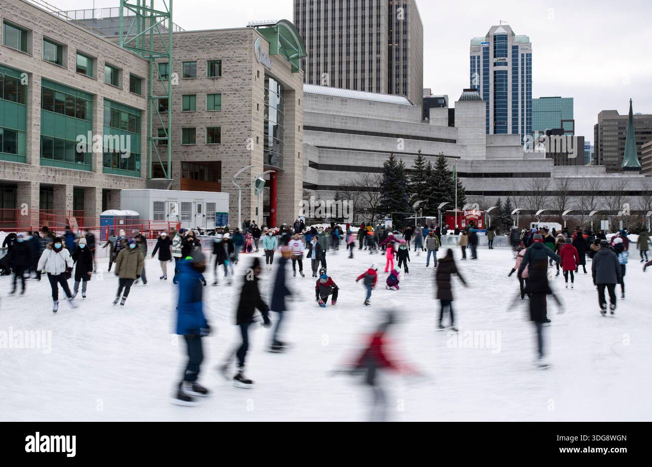 People ice skate outside Ottawa City Hall on Tuesday, Dec. 28, 2021 ...