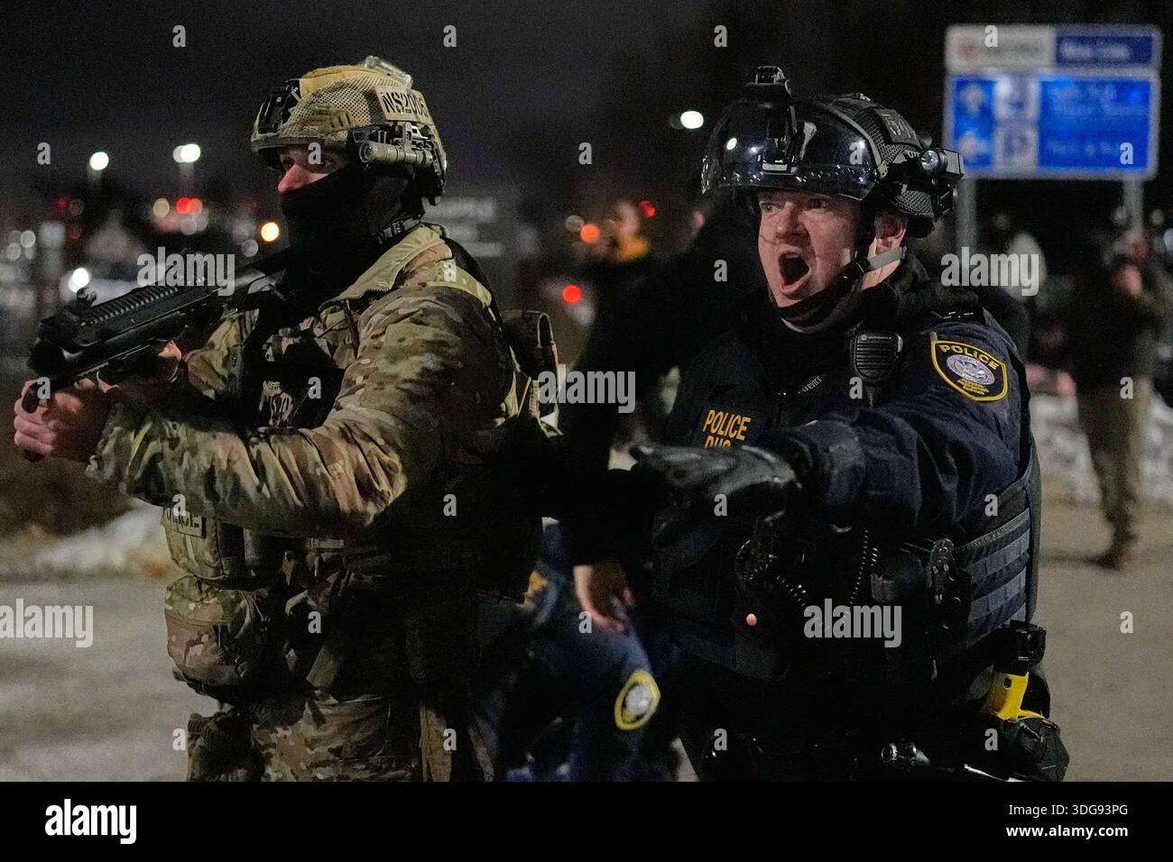 Federal immigration officers confront protesters outside Bishop Henry ...