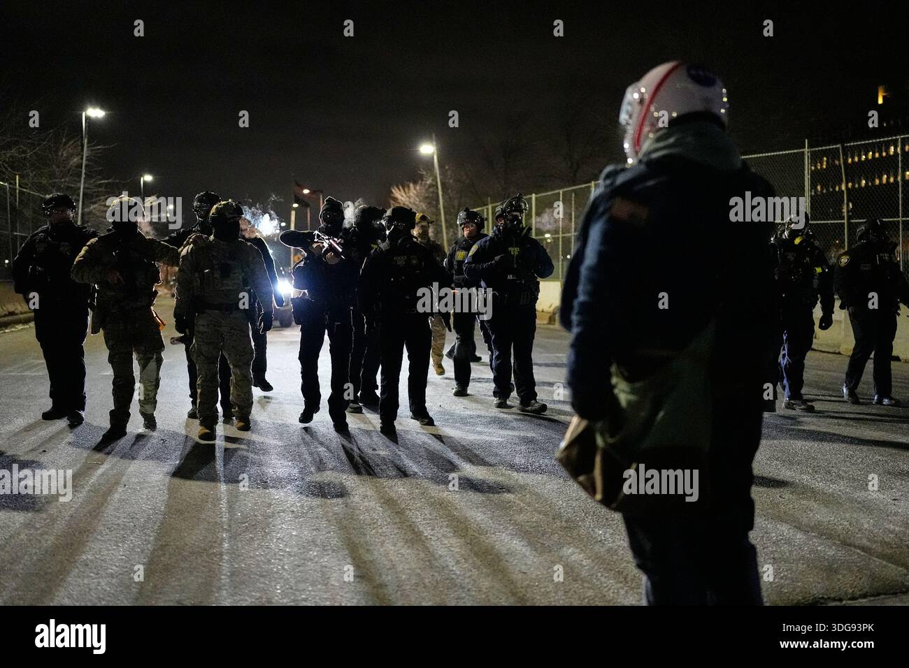 Federal immigration officers confront protesters outside Bishop Henry ...