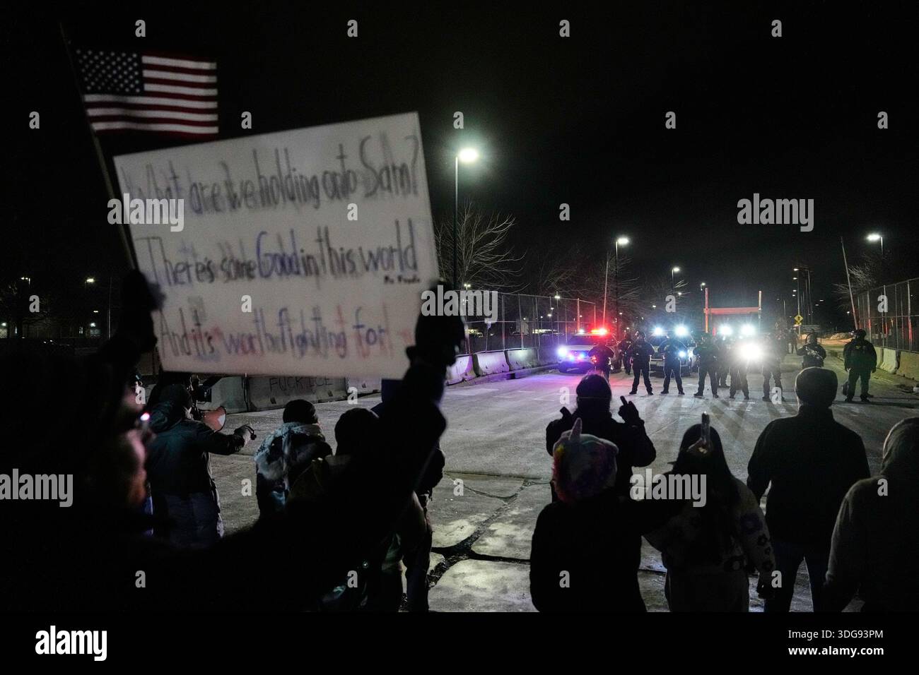 Federal immigration officers confront protesters outside Bishop Henry ...
