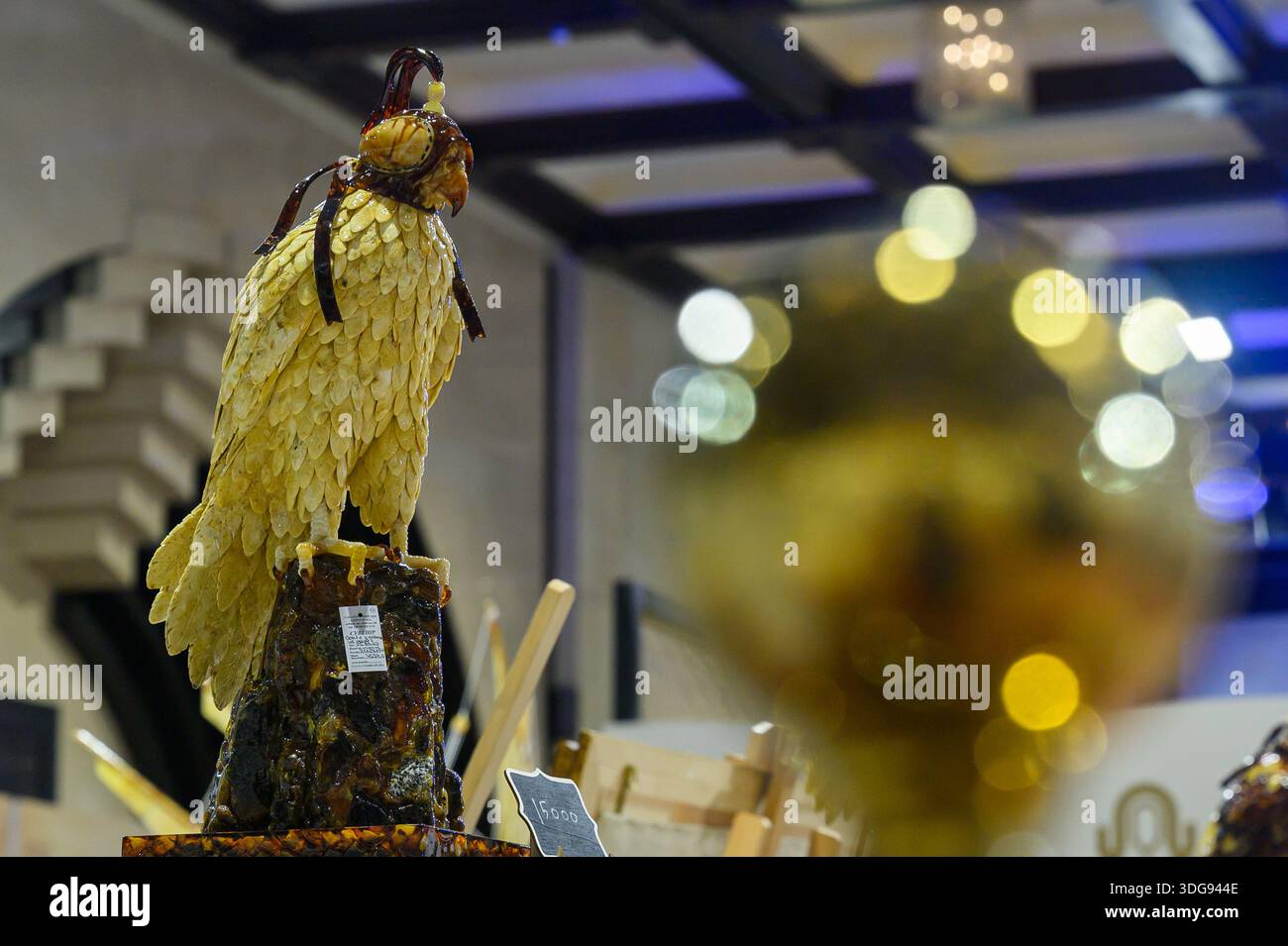 Doha, Qatar. 15th Jan, 2026. A falcon sculpture made of amber is ...