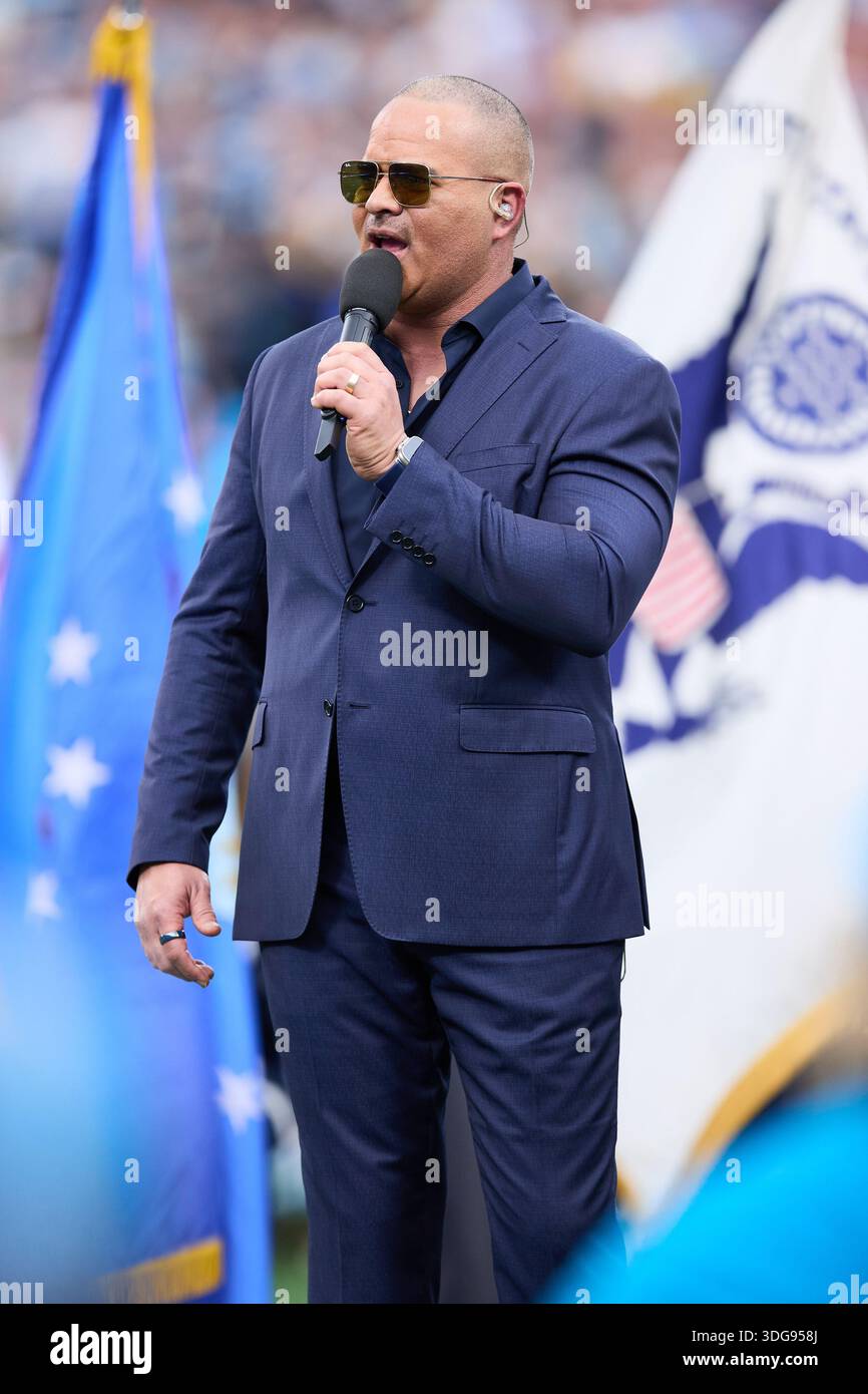 Christopher Jackson sings the National Anthem prior to an NFL wild card ...