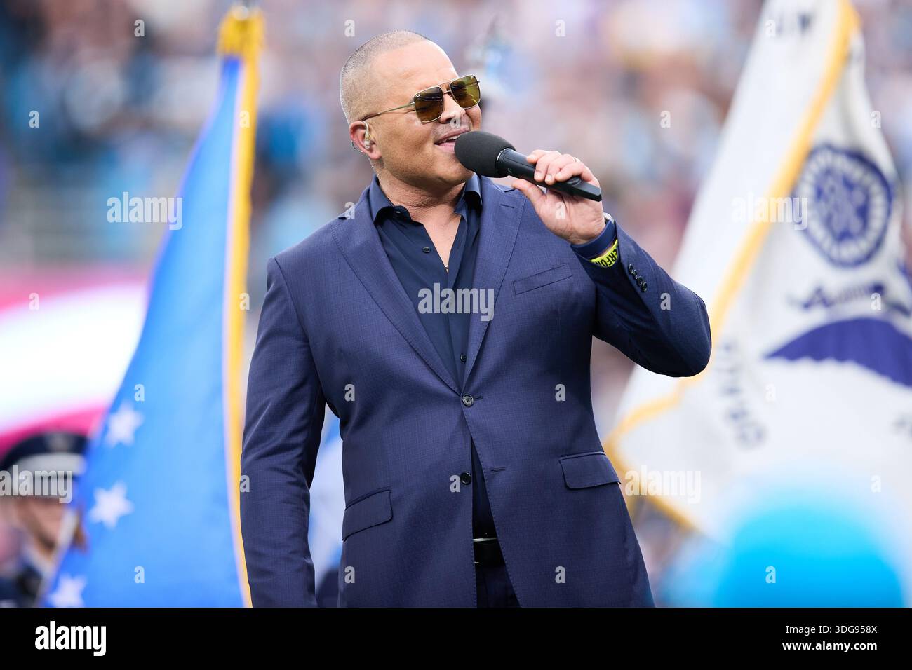 Christopher Jackson sings the National Anthem prior to an NFL wild card ...