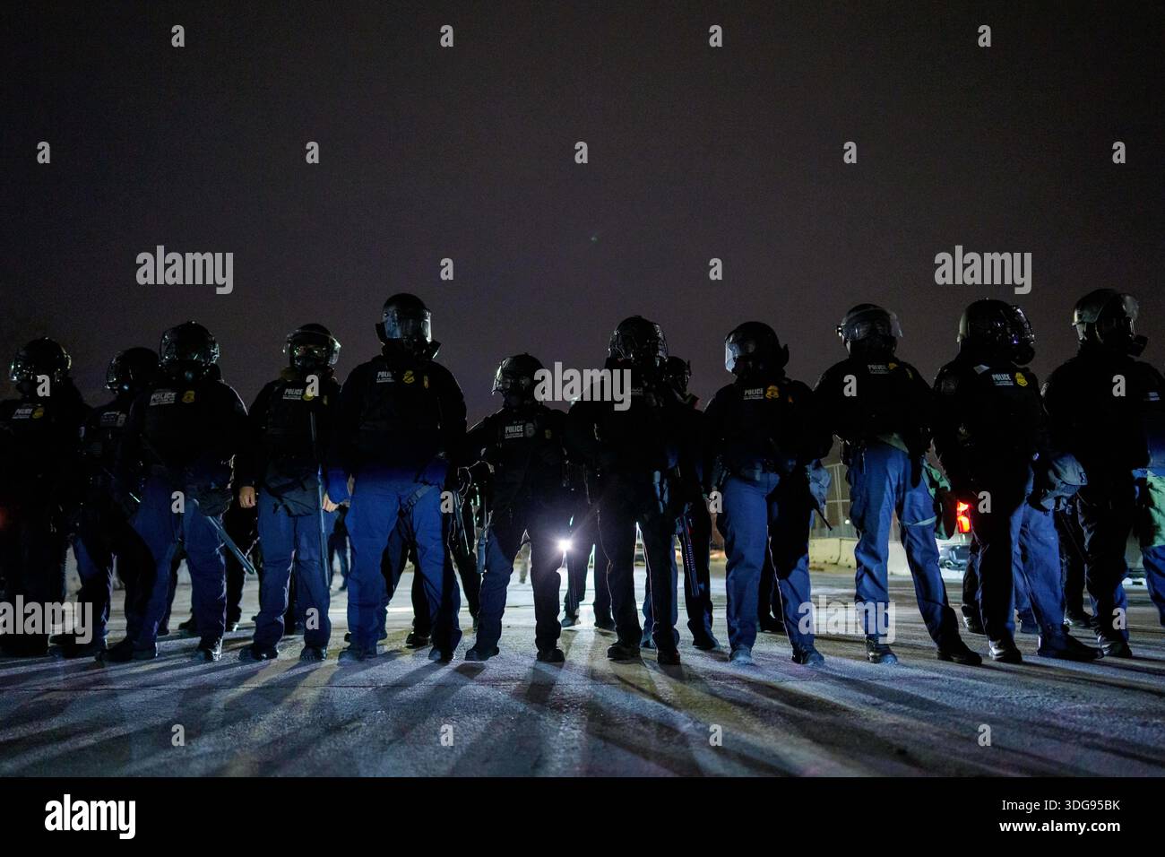 Federal immigration officers confront protesters outside Bishop Henry ...