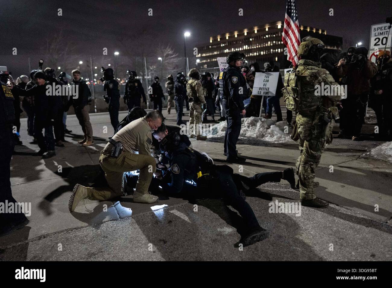 Federal immigration officers detain a protester outside Bishop Henry ...