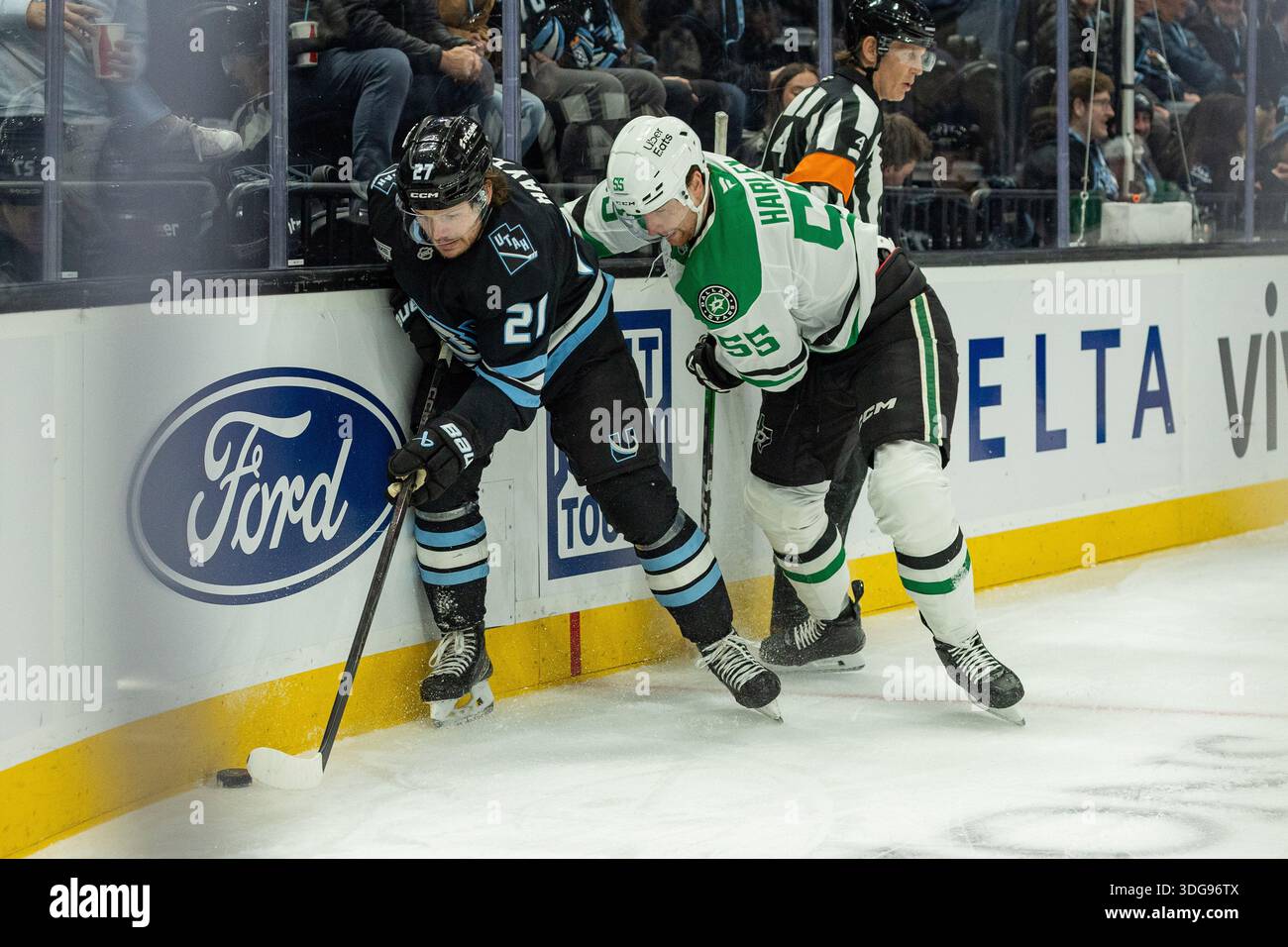 Utah Mammoth center Barrett Hayton (27) fights for the puck against ...