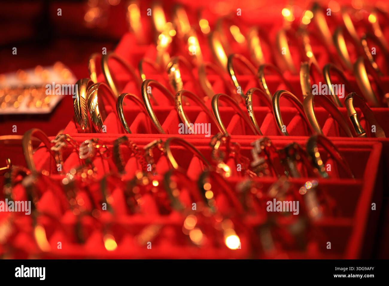 Customers select gold jewelry at a store in Huai'an City, east China's ...