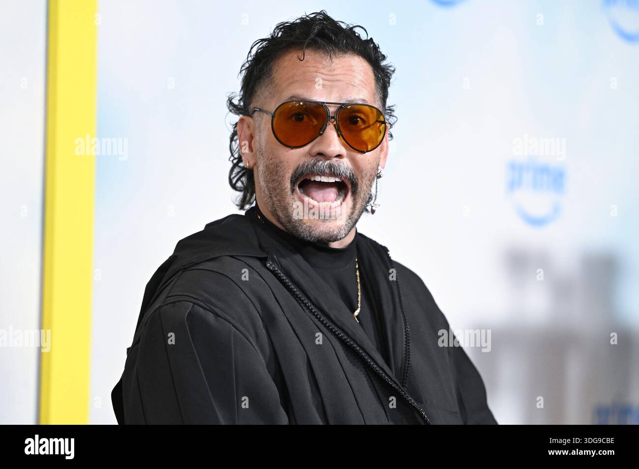 Director Angel Manuel Soto walking the red carpet at 'The Wrecking Crew ...