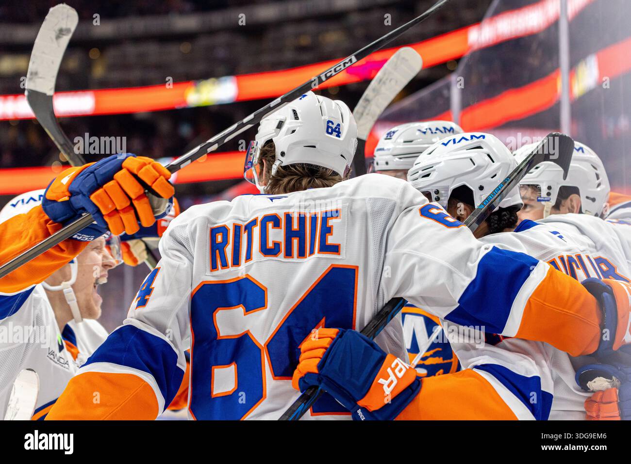 New York Islanders' Calum Ritchie (64) celebrates with teammates after ...